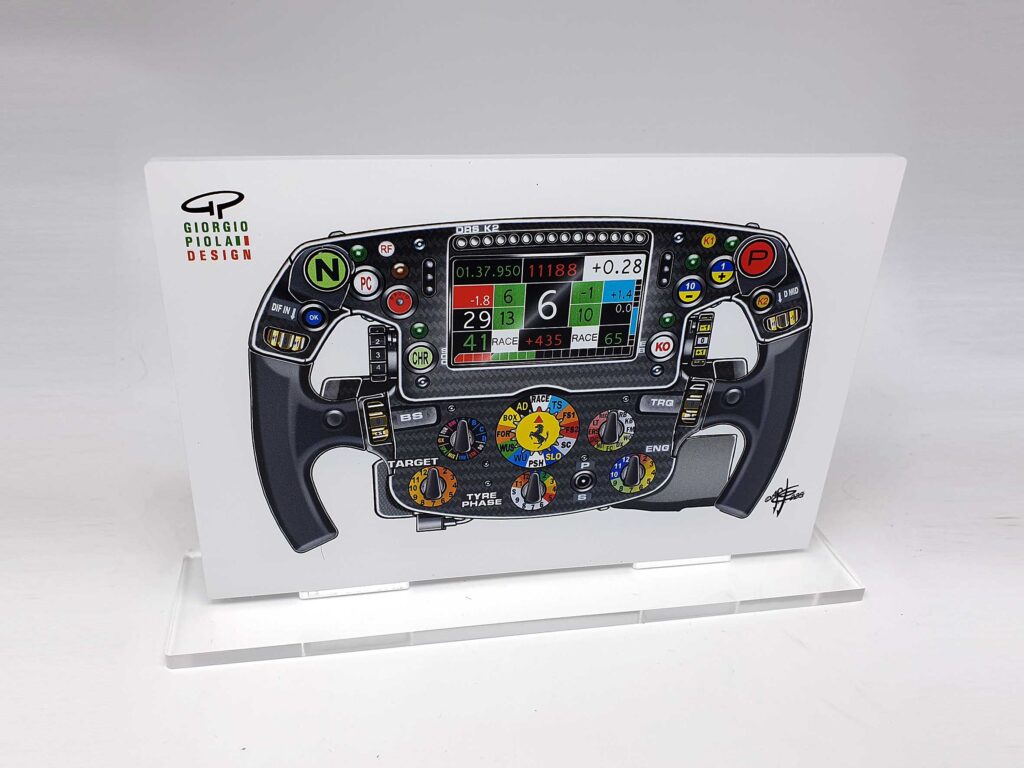 The 2025 Ferrari SF-25 steering wheel on white plexiglass - Giorgio ...